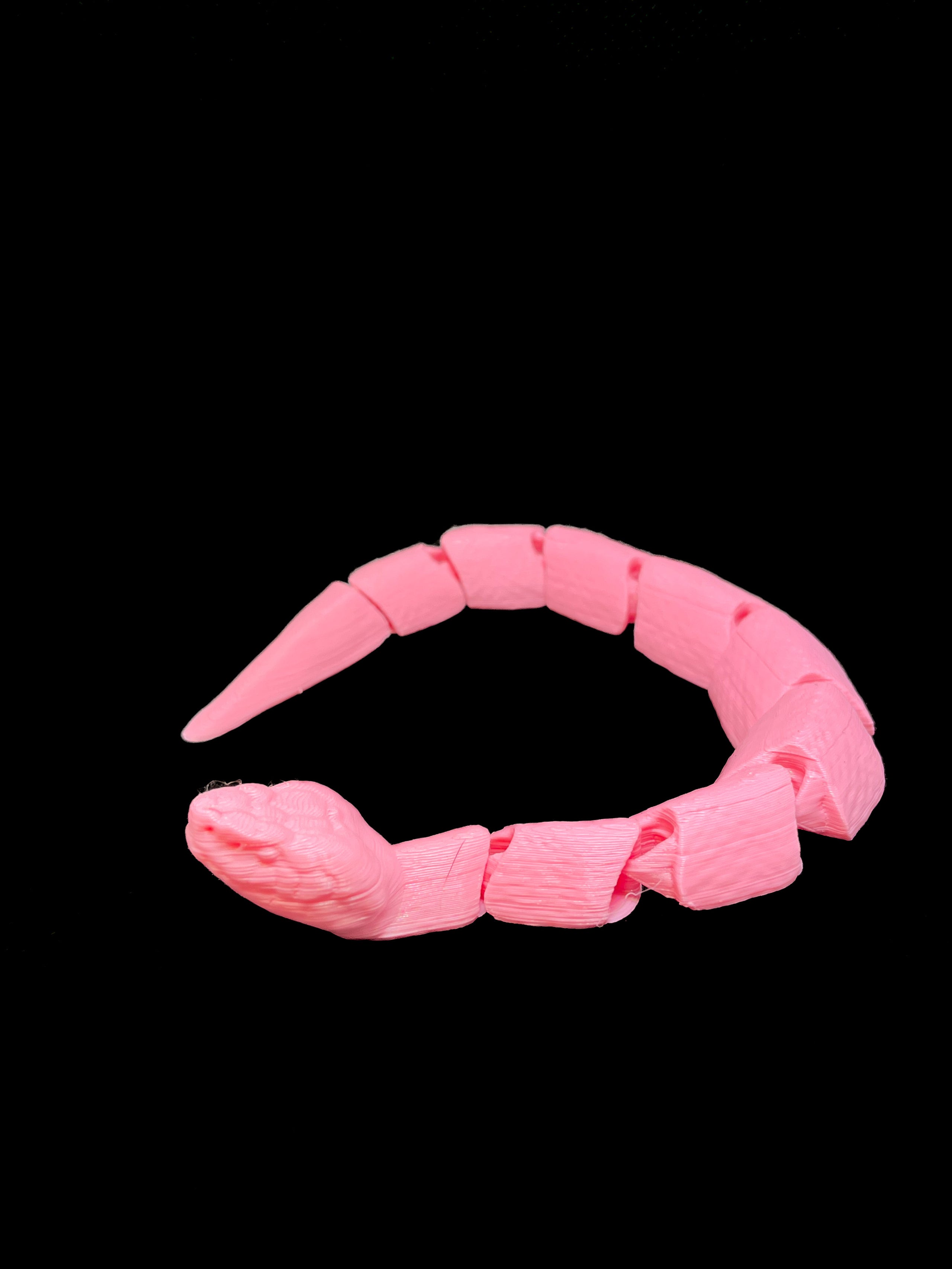 articulated-pink-copperhead-snake-black-creek-wildlife-center